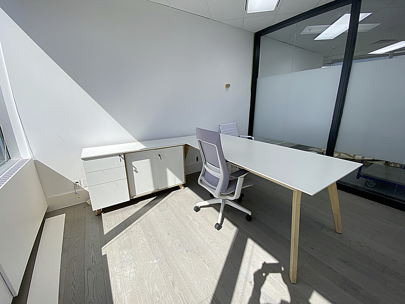 White Executive Desk With Beveled Edges And An Angular Leg Design ...